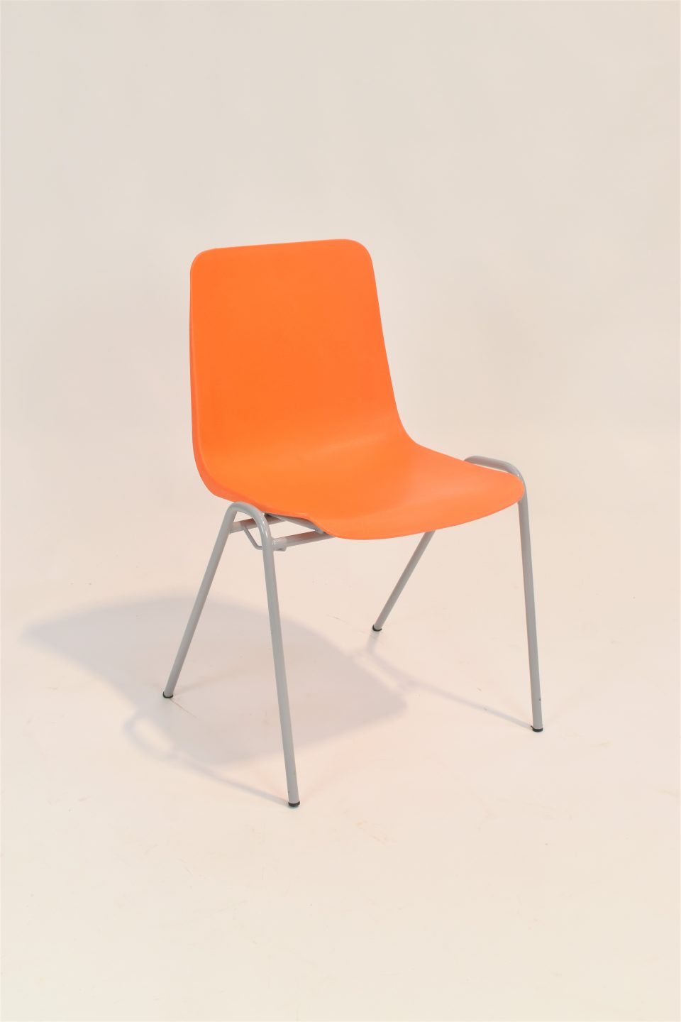 Orange Plastic Stacking Chair - The Classic Modern Prop Hire Company